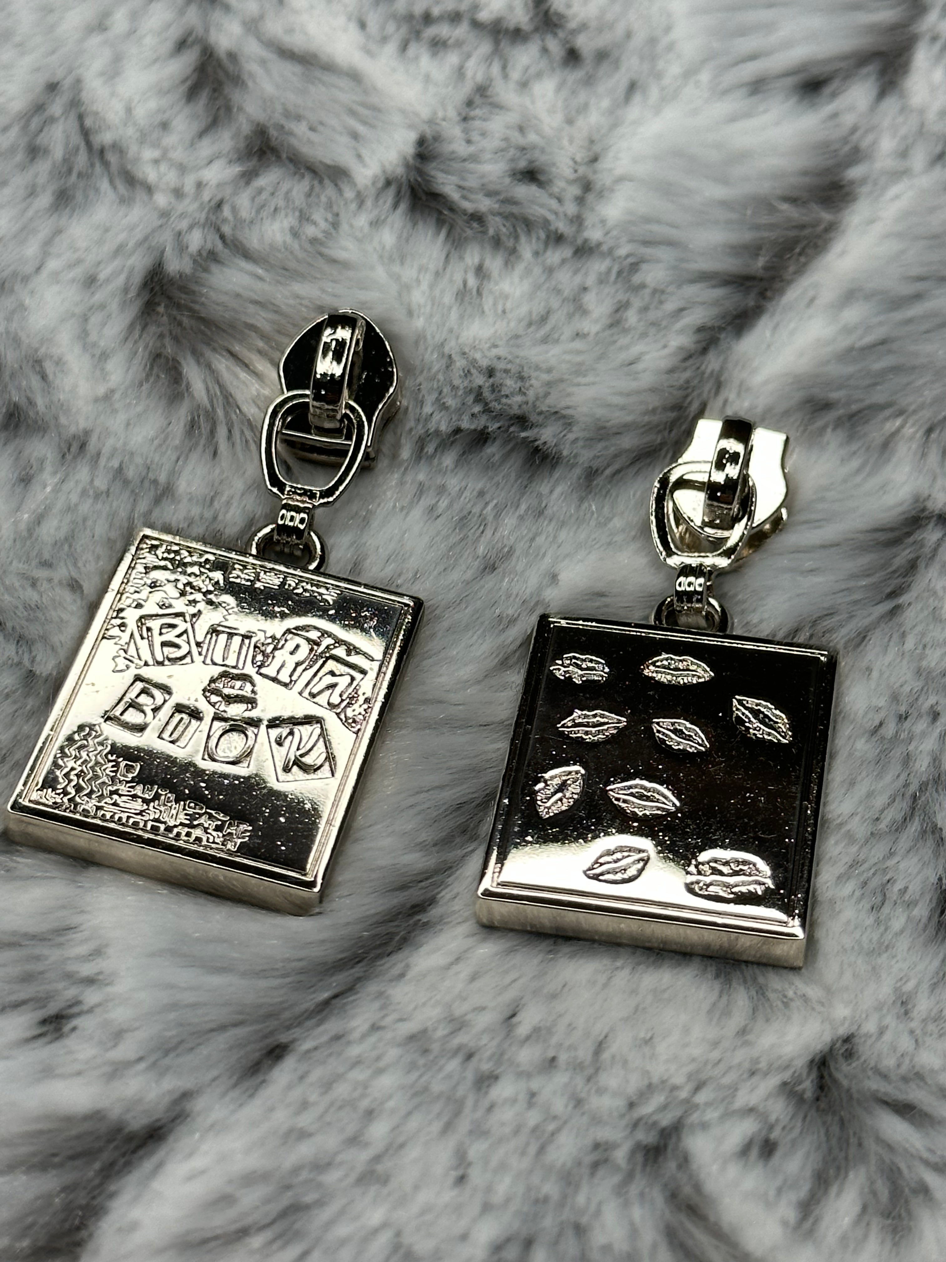 Burn Book Zipper Pull (2- sided silver) – RAW DESIGNS CCTX