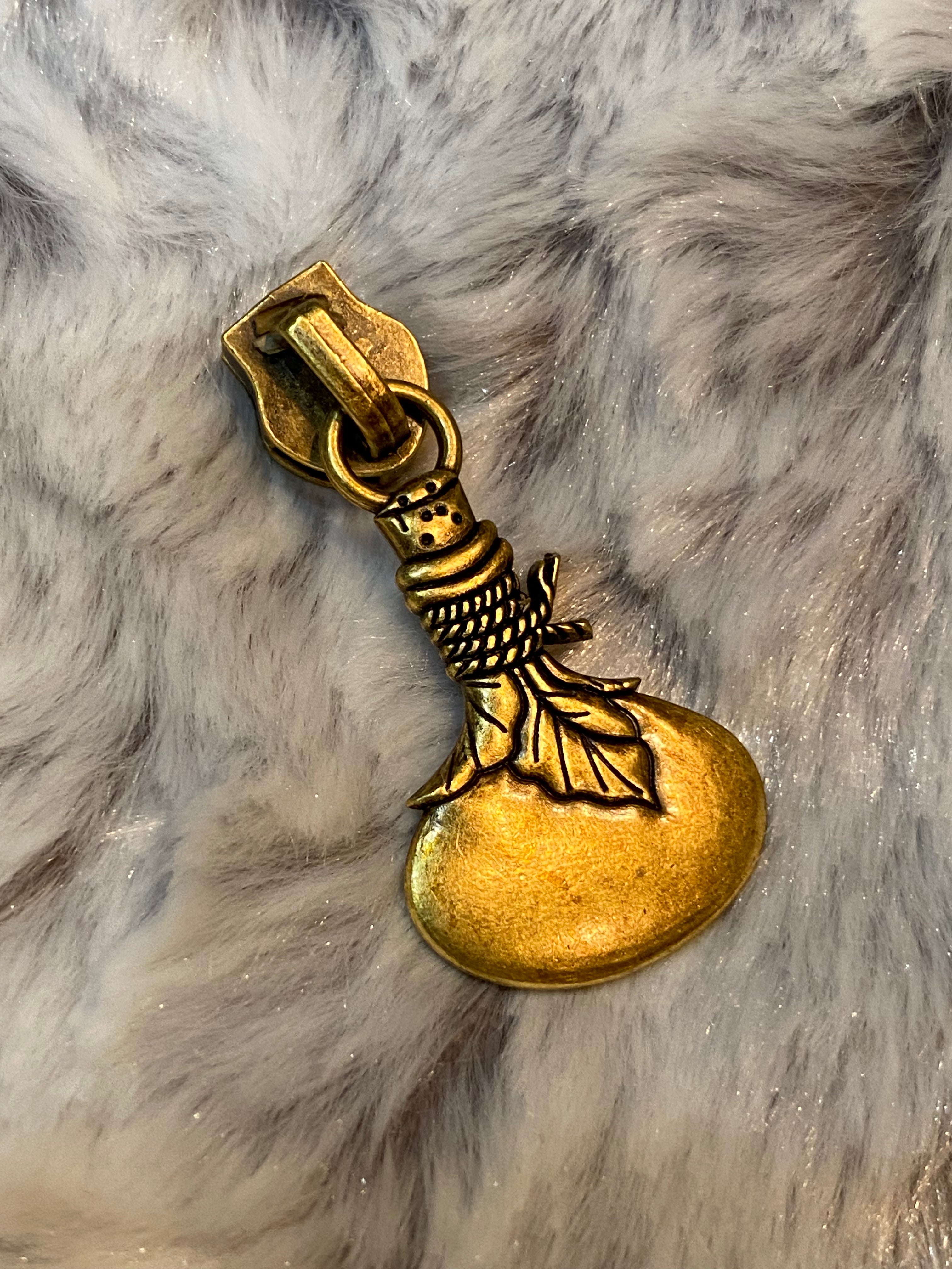 Magic Powder Bag Zipper Pull (Bronze Finish) – RAW DESIGNS CCTX